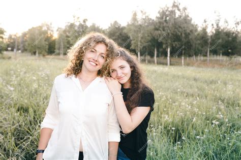 Premium Photo Two Lesbian Girls Are Sitting On The Grass In The Park