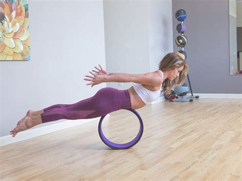 3 New Ways To Use A Yoga Wheel — Yogabycandace