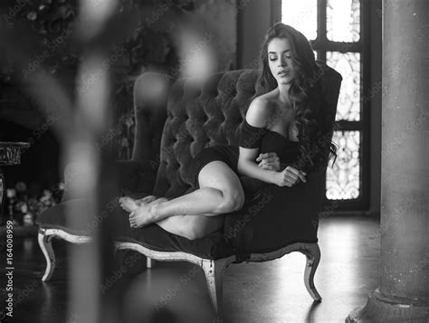 Spanish Woman In A Sexy Little Dress Posing In A Vintage Interior