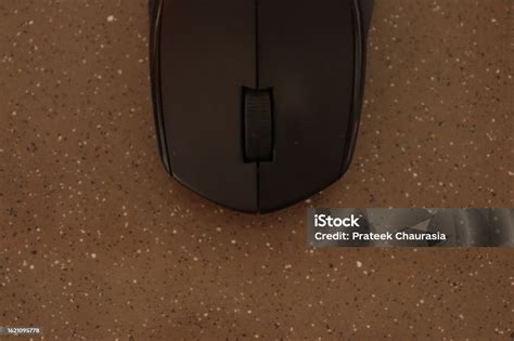 Half Shot Of A Black Three Button Computer Mouse With Scroll Button On