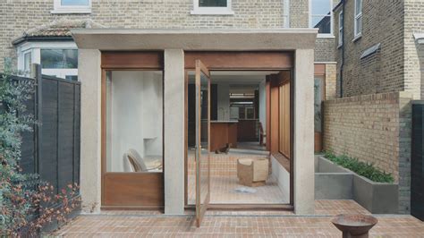 Cast House Extension By Ebba Has Brown Concrete And Vaulted Ceiling