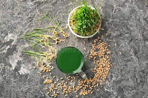 Composition With Fresh Wheat Grass Juice On Table Top View Stock Image