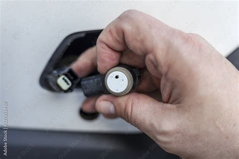 Car Mechanic Changes The Parking Sensor On The Car The Sensor Malfunction Of Parking Sensors