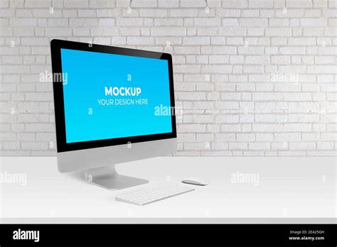Mockup Display Screen Blank Computer On Desk With White Wall Office