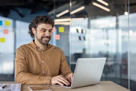 Mature Experienced Programmer Inside Office At Workplace Businessman