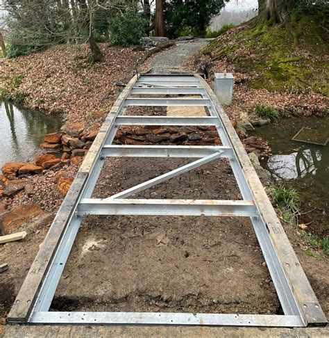 working with dart fabrication to install a stunning new garden bridge