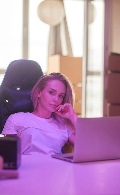 Premium Photo Young Blonde Woman Barcode Printer And Boxes On The