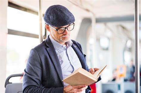 Premium Photo Man In Bus Reading Book