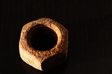 Premium Photo Large Old Rusty Nut Close Up On Black Background