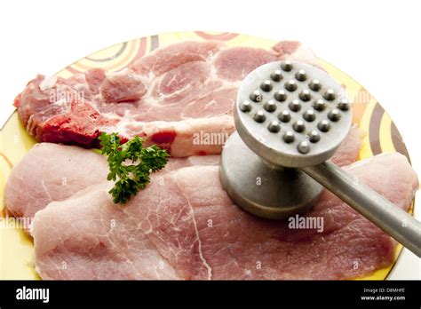 Meat hammer with meat Stock Photo - Alamy