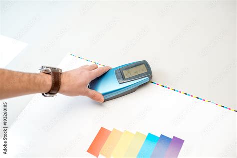 Measuring Color On The Paper Print With Spectrometer Tool At The