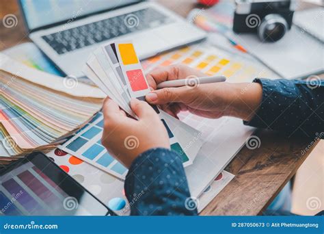 Graphic Designer Architects Who Work With Laptops And Color Comparison Tables For Design Work
