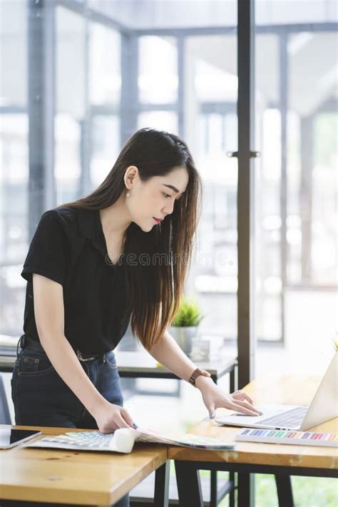Graphic Designer Working On Computor And Graphics Tablet In Her Working