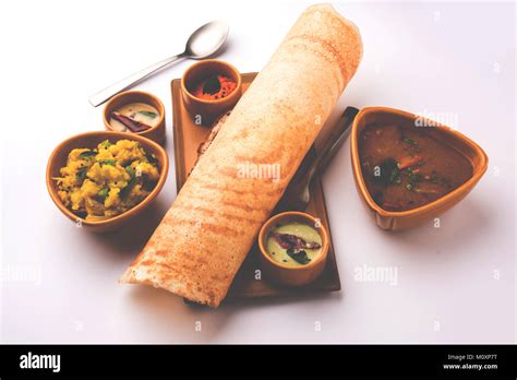 Masala Dosa With Chutney And Sambar And Potato Sabzi Cone Triangle Or