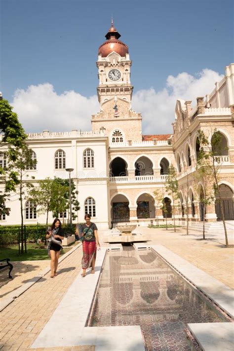 Two Women Walking At Sultan Abdul Samad Building Area Editorial