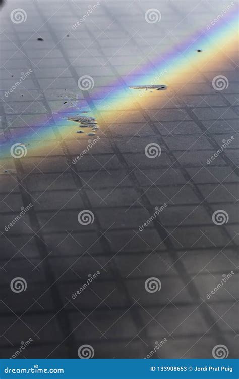 Rainbow Reflected On A Puddle Stock Image Image Of Architecture