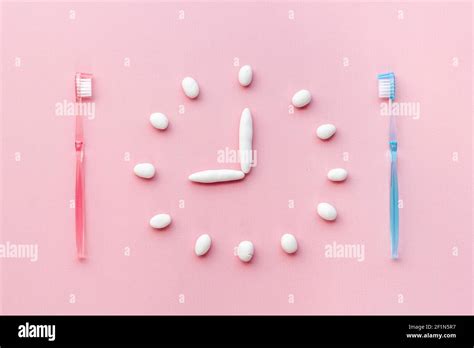 Clock Made Of Toothpaste With Toothbrushes Oral Care And Dental Hygiene Concept Stock Photo Alamy