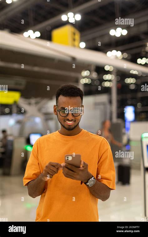 Young Handsome Black Man Ready To Travel At Airport Terminal Waiting