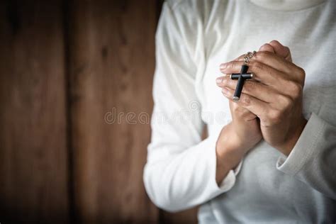 Woman Holding A Cross In Her Hands And Praying Pray For Blessings From