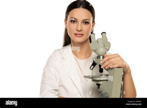 Portrait Of Female Scientist With Microscope On A White Background