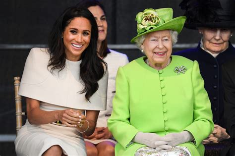 Charlie Hebdo Cover Shows The Queen Kneeling On Meghan Markles Neck