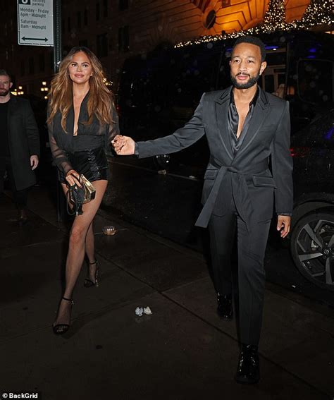 Chrissy Teigen Pairs Tiny Hot Pants With A Sheer Blouse As She And