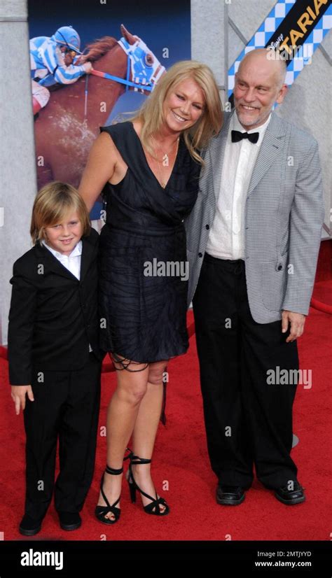 John Malkovich And Guest Walk The Red Carpet At The World Premiere Of