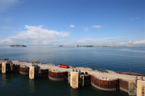 A Landscape Shot Of Part Of The Ferry Terminal With A Ship In The