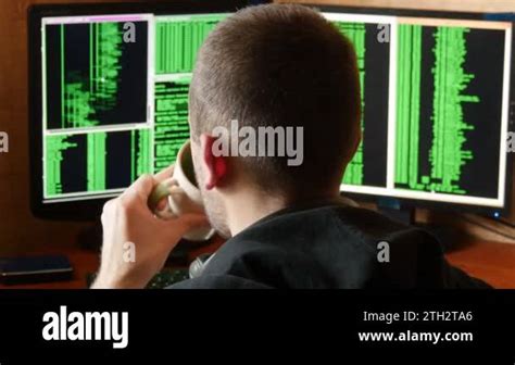 Hacker Breaking Code And Drinking From The Cup At Your Desk Criminal