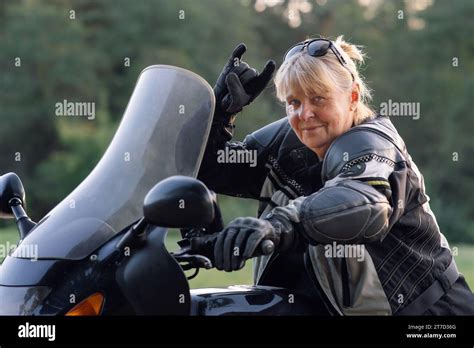 Super Mom Blonde Biker Granny Gestures Ok While Sitting On Her