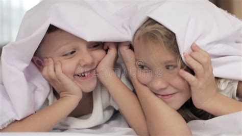 Lovely Brother And Sister Lying In Bed At Home Stock Video Video Of