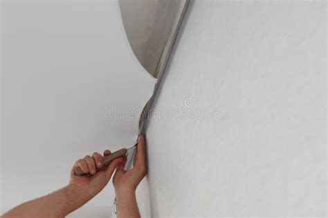 A Man Attaches The Stretch Ceiling To The Profile Stock Image Image