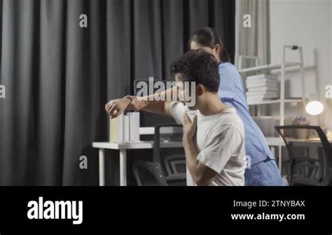 The Female Doctor Asked The Male Patient To Do Physical Therapy With