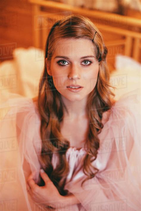 Attractive Blonde Bride In Bohemian Wedding Dress Looking At Camera