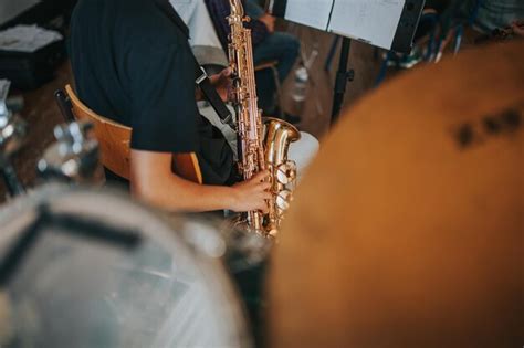 Premium Photo Midsection Of Man Playing Saxophone