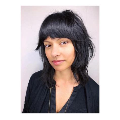 Black Shaggy Razor Cut Bob With Full Fringe Bangs And Undone Texture
