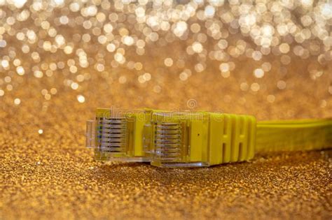 A Yellow Ethernet Cable In Front Of A Shiny Background By Assega Stock