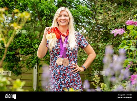 Becky Adlington Poses With Her Olympic Medals At Home In Marple