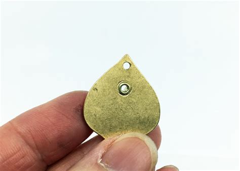 How To Rivet Two Metal Pendants Together For A Unique Design The Beading Gem