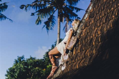 Free Photo Hippie Girl With Long Blond Hair In A Dress On The Roof