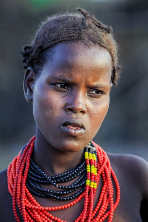 Dassanech Tribe Old Woman With Traditional Bright Necklace In The Local