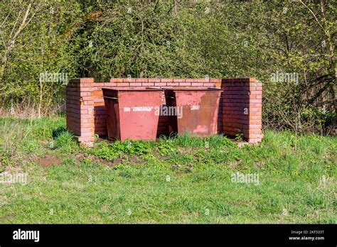 Garbage Cans In Nature In A Brick Shelter Garbage Disposal Site