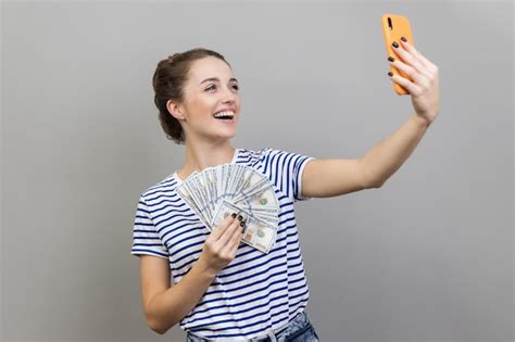 Premium Photo Woman Making Selfie With Money Hiding Face Behind Fan