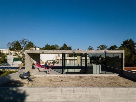 Gardens Surround Board Marked Concrete House In Mexico City By Ppaa