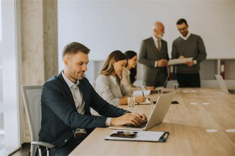 Premium Photo Young Business Man Using Laptop Computer In The Office