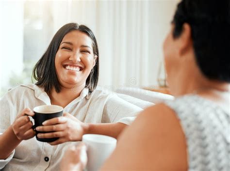 Mama Knows Best A Senior Woman Bonding With Her Daughter On The Sofa