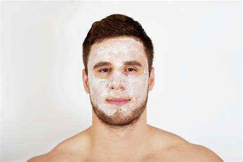 Man With Cream Moisturizer On His Face Featuring Handsome Man And