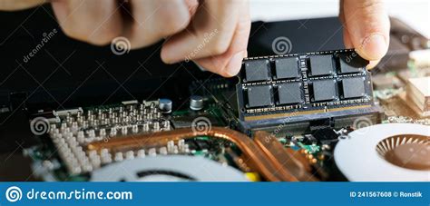 Technician Installing Ram Memory Module In Laptop Motherboard Computer Hardware Upgrade Stock