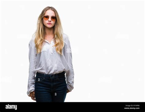 Young Beautiful Blonde Woman Wearing Sunglasses Over Isolated