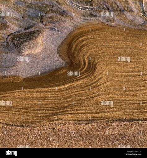 Abstract Detailed Tidal Patterns In The Sand At Low Tide On Penbryn Beach In South West Wales Uk